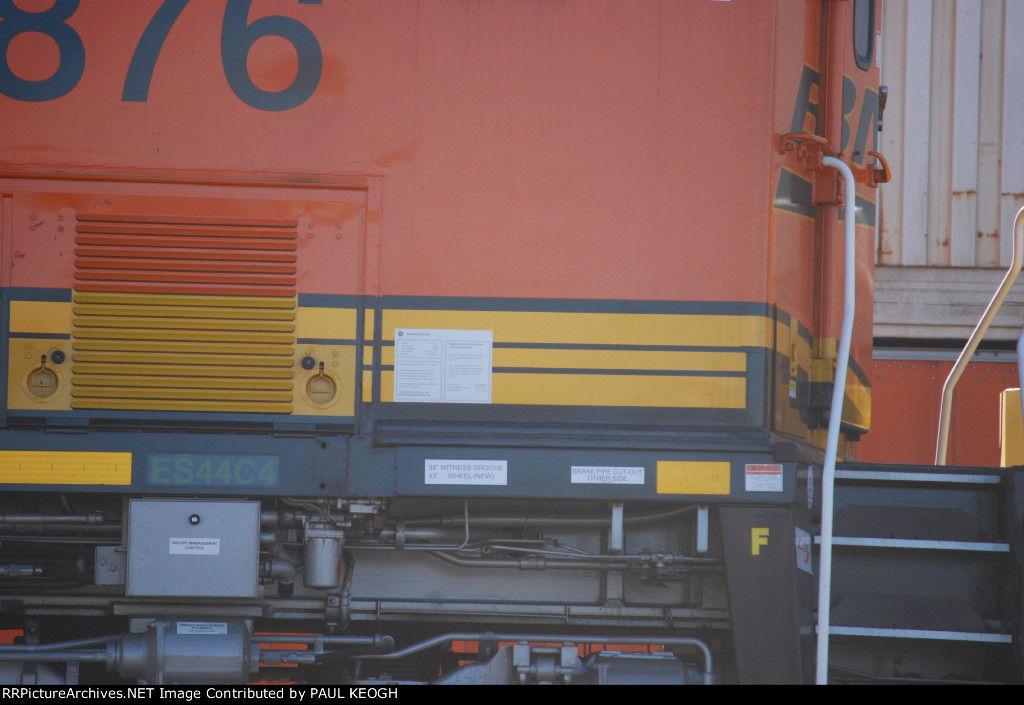 BNSF 6876's GE DATA PLATE as she passes me. (Close Up as I can get with a 200MM Lense).